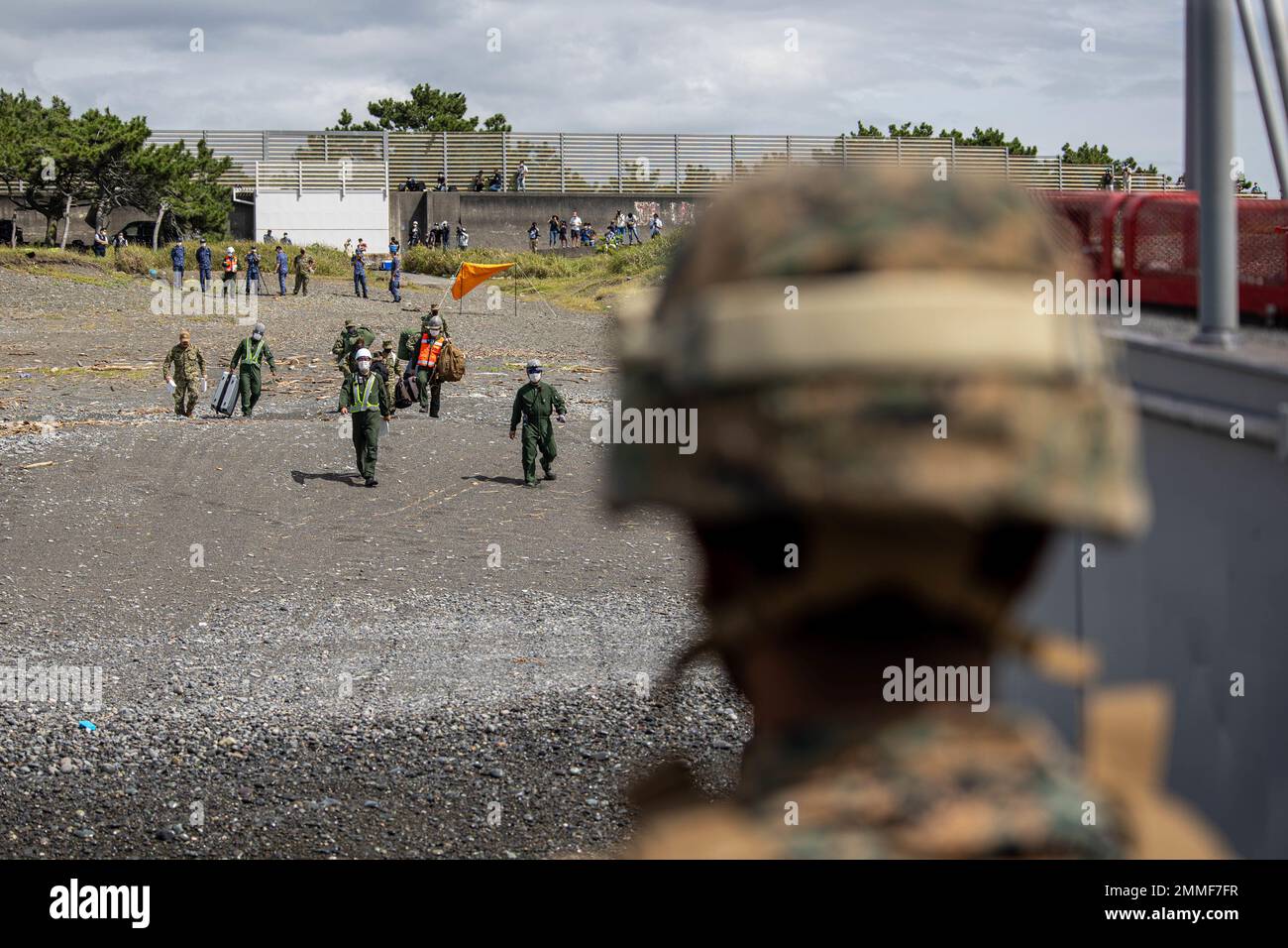 A U.S. Marine with the 31st Marine Expeditionary Unit (MEU) observes U ...