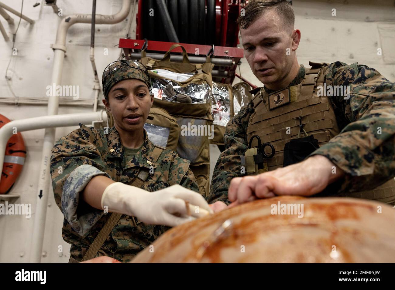 U.S. Navy Lt. Cmdr. Marissa Mayor, left, a general surgeon with 2nd ...