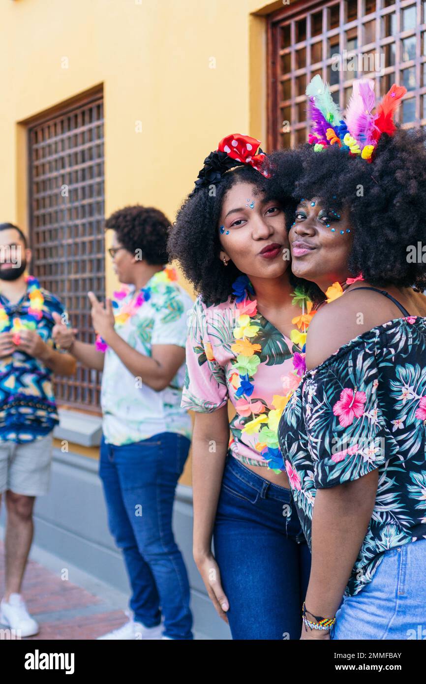 Two friends enjoying themselves during the annual carnival street ...
