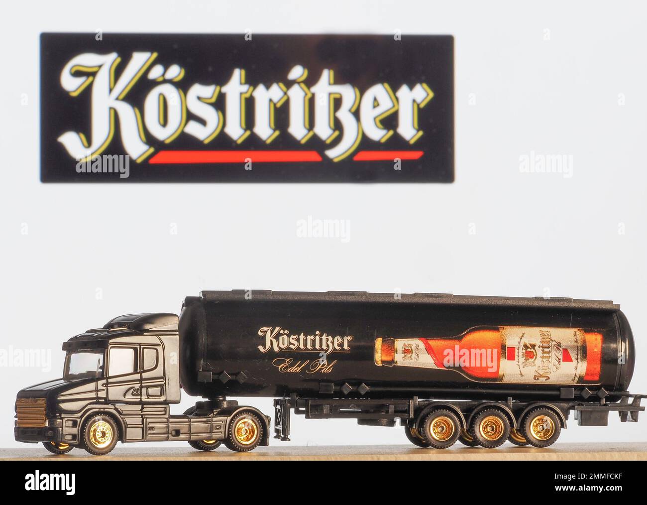 In this photo illustration, a model of a beer truck with an inscription ...