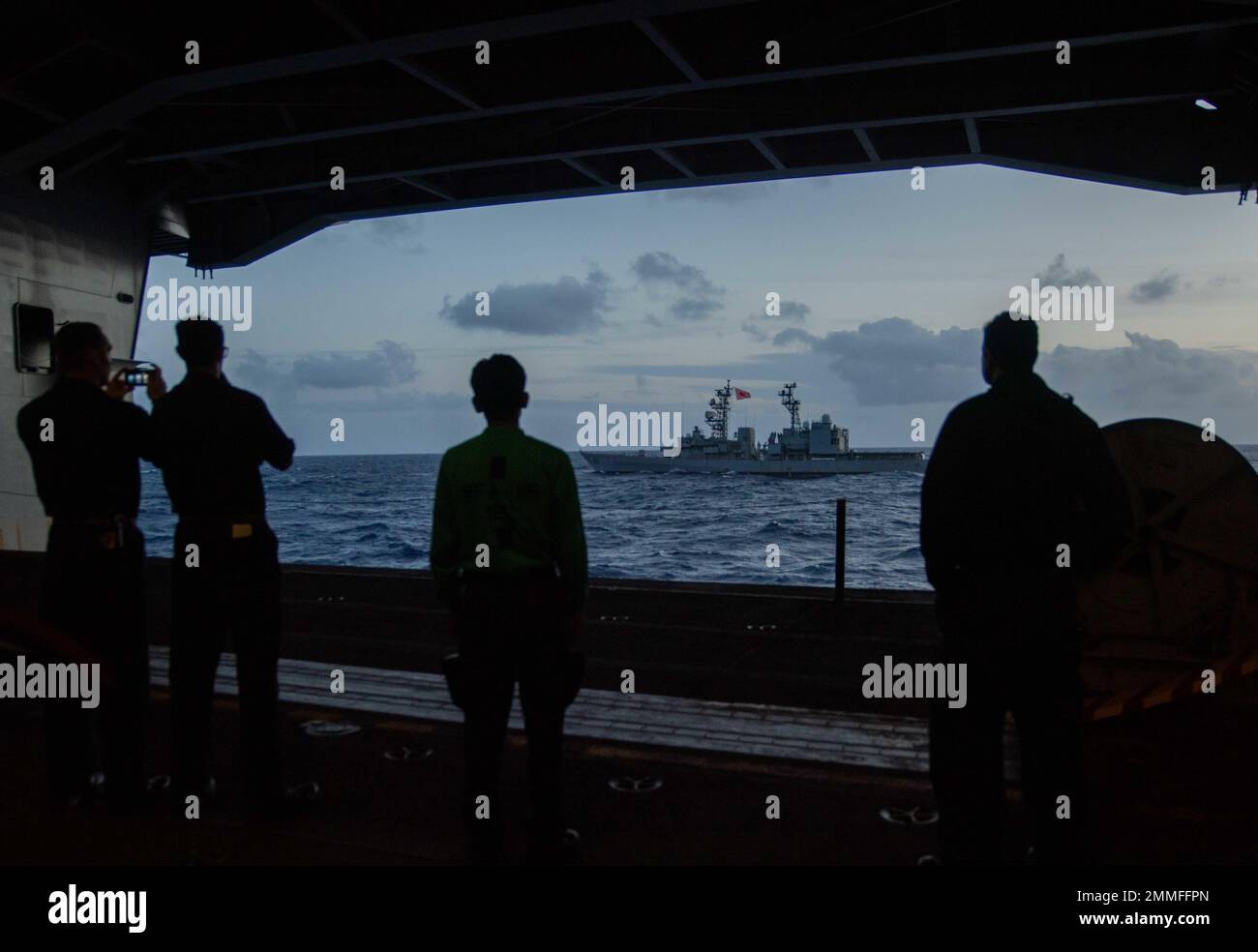 PHILIPPINE SEA (Sept. 17, 2022) Sailors observe as JS Amagiri (DD 154 ...