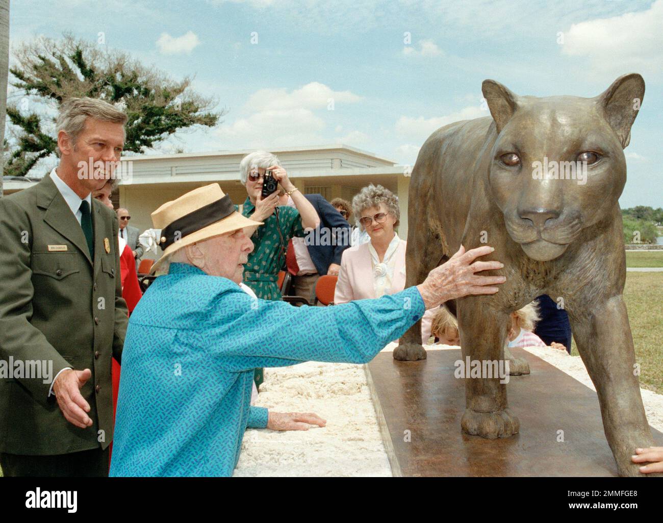 100-year-old environmentalist Marjory Stoneman Douglas touches a bronze ...