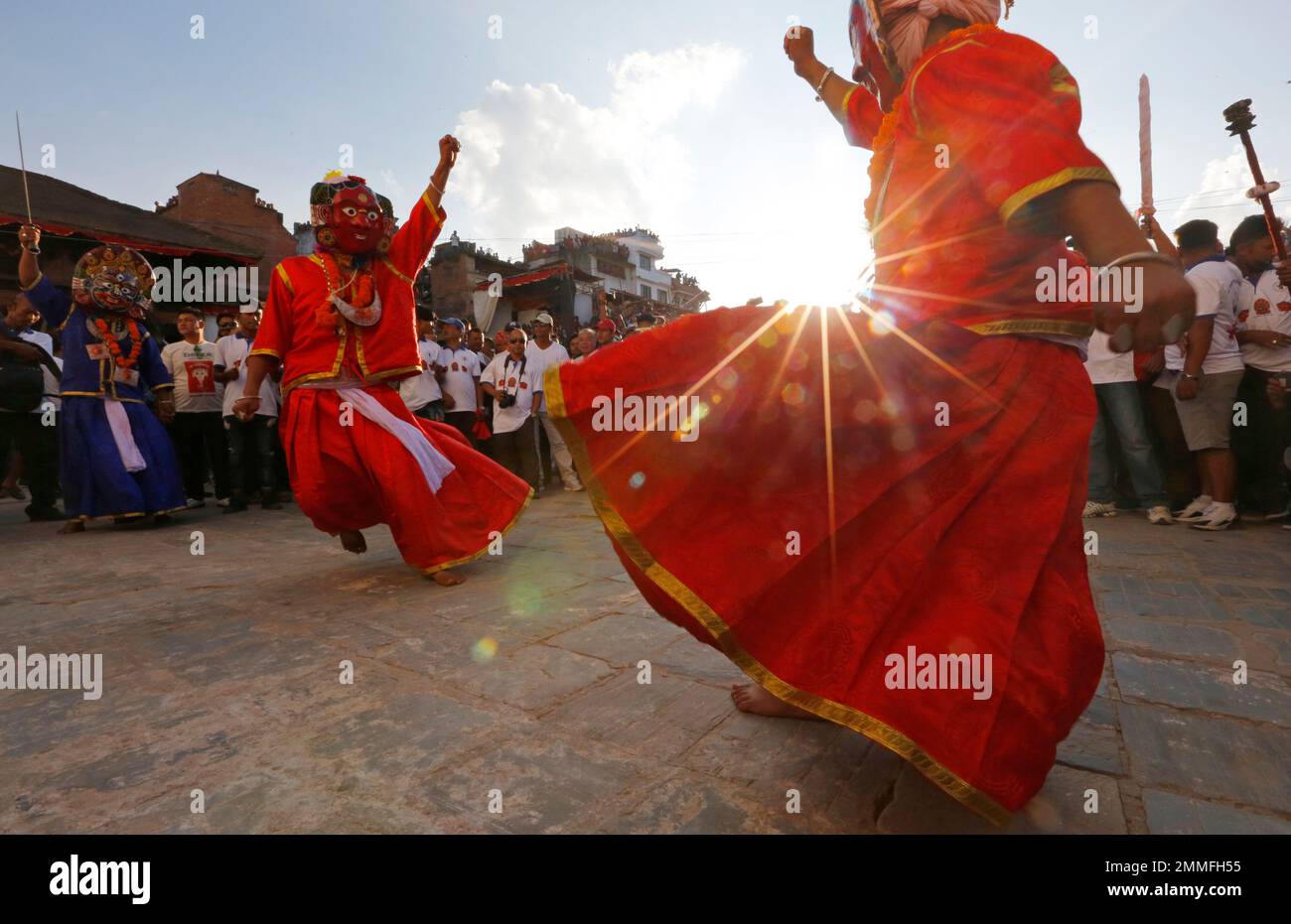 Masked dancers perform a traditional dance during Indra Jatra festival ...