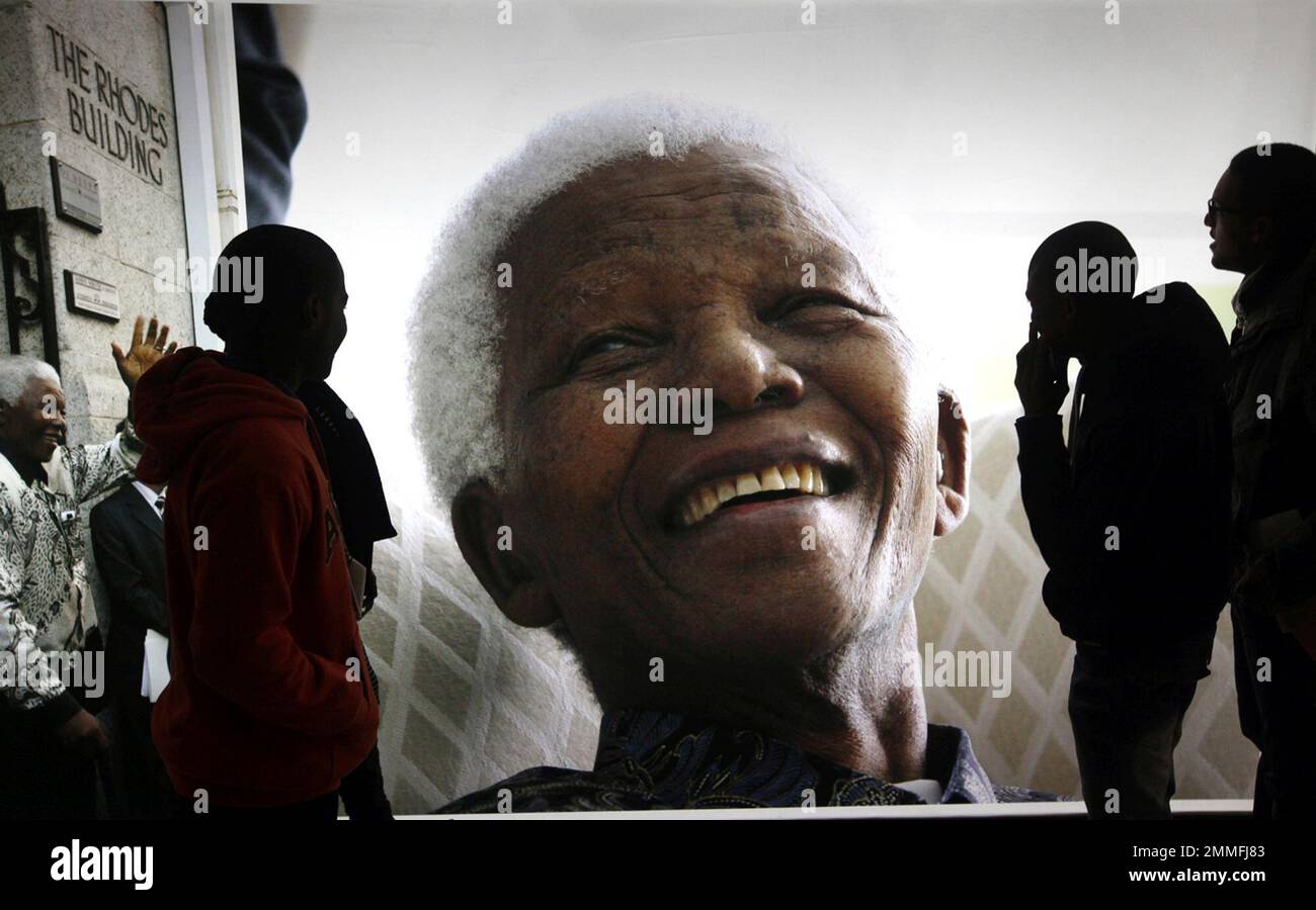 FILE - In this June 27, 2013 file photo, large photographs of former ...