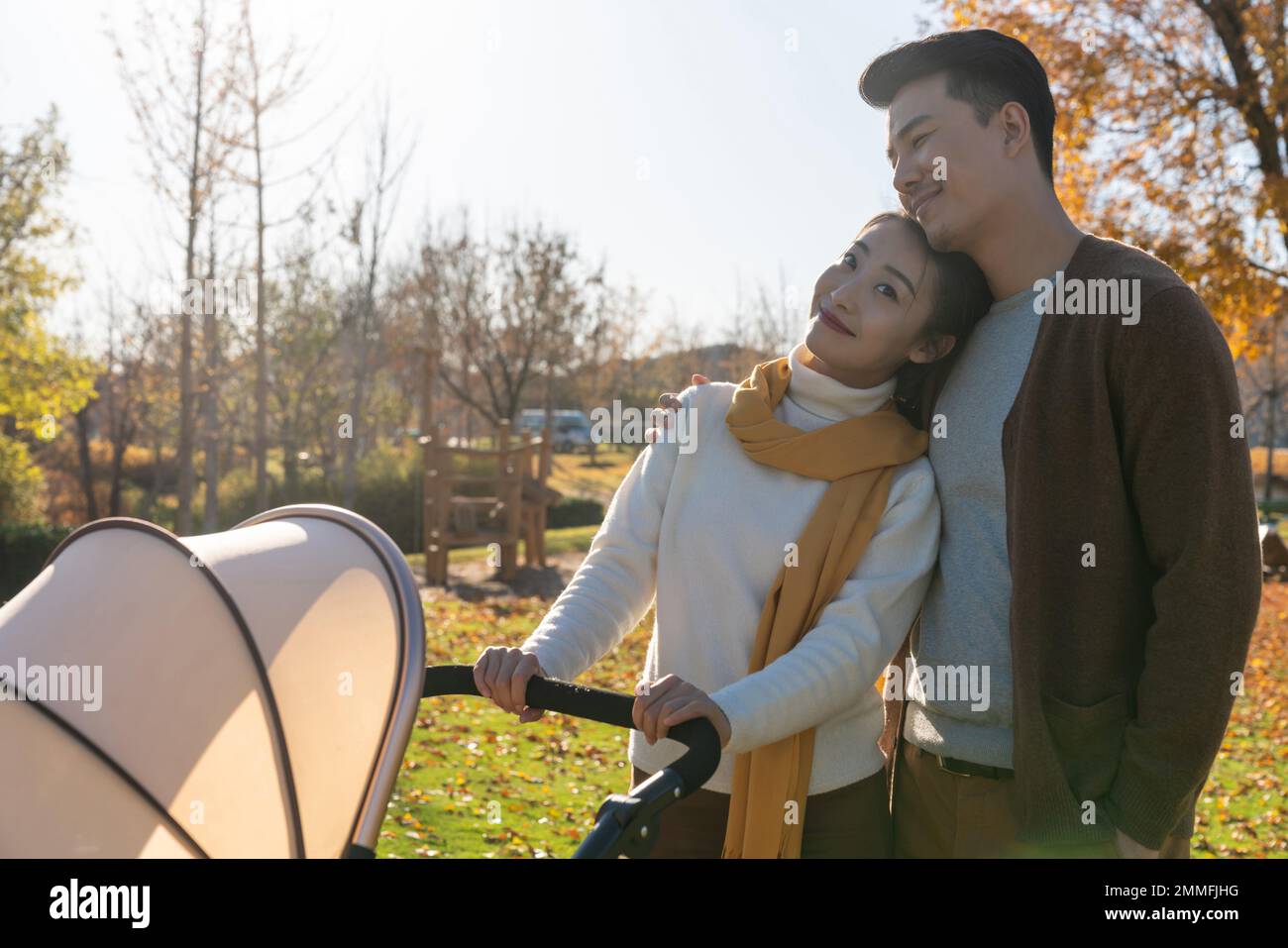 Family parents father mother pushing stroller hi-res stock photography ...