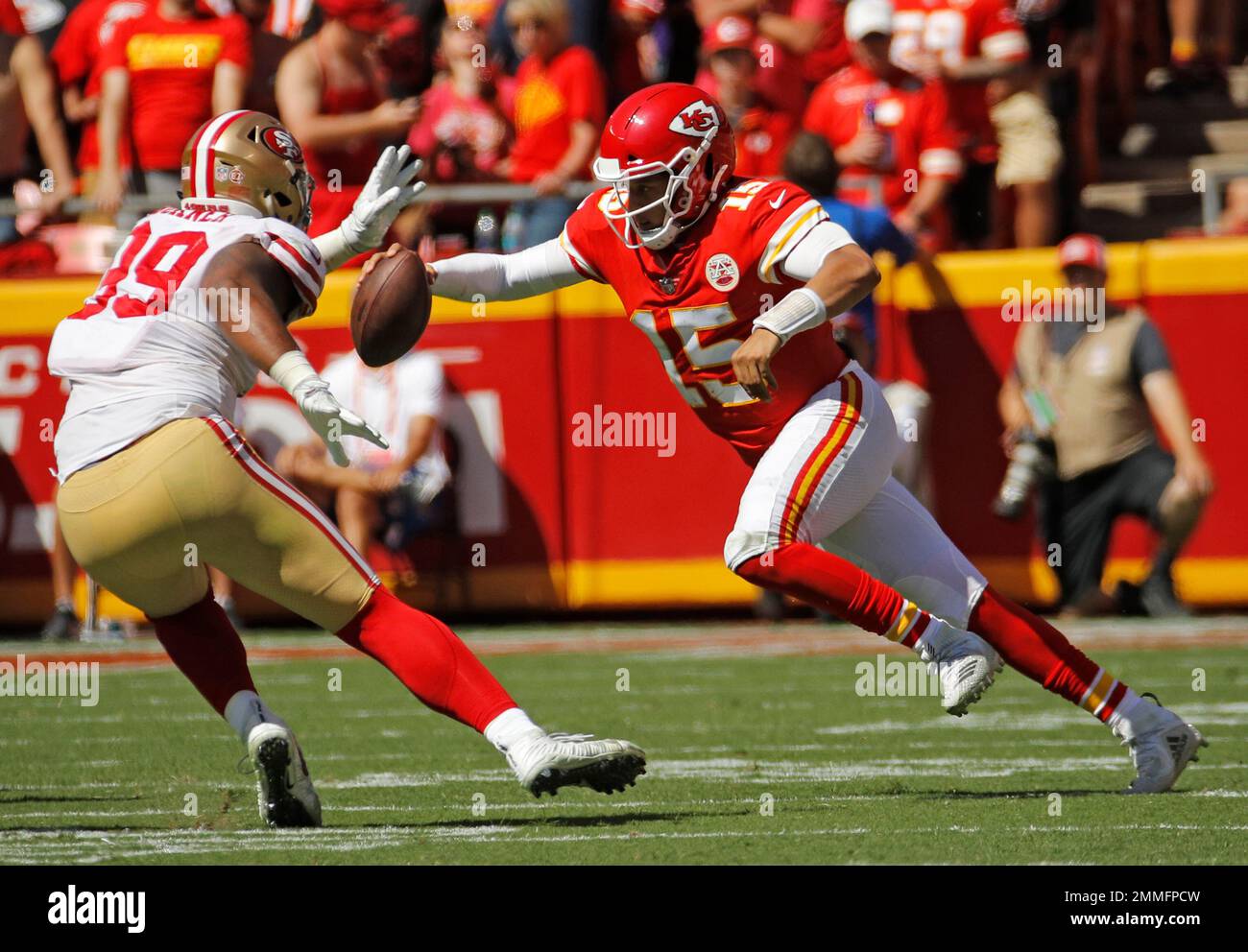 Kansas City Chiefs quarterback Patrick Mahomes (15) scrambles away from ...