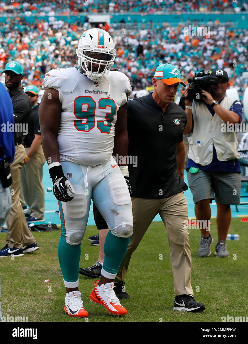 Miami Dolphins defensive tackle Akeem Spence (93) is escorted off the ...