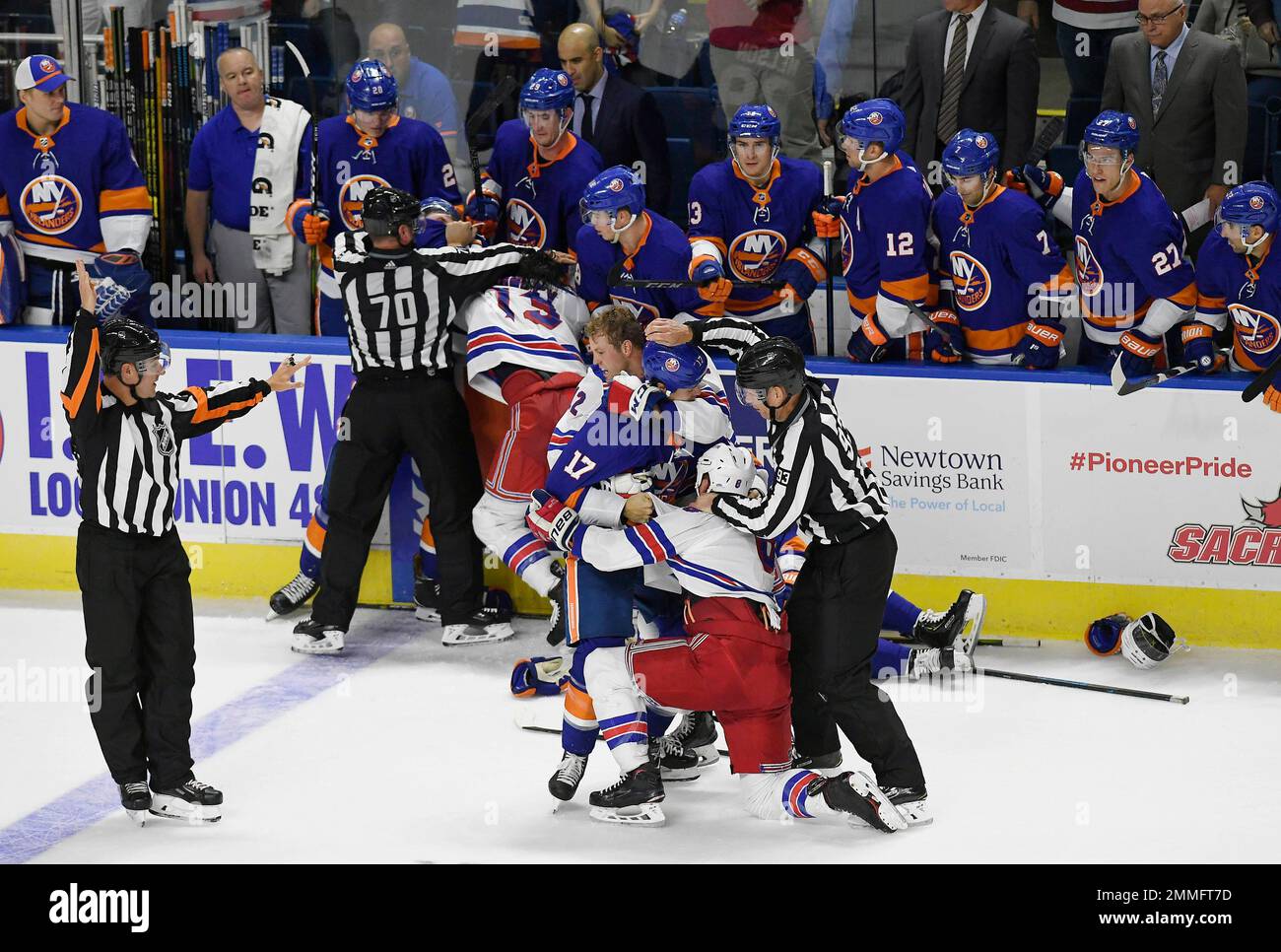 The New York Rangers and Islanders fight during the second period of a ...