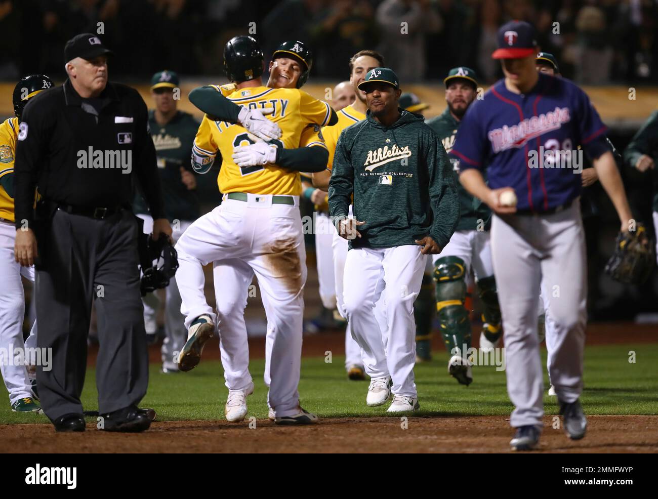 Oakland Athletics' Stephen Piscotty (25) is embraced by Matt Chapman ...
