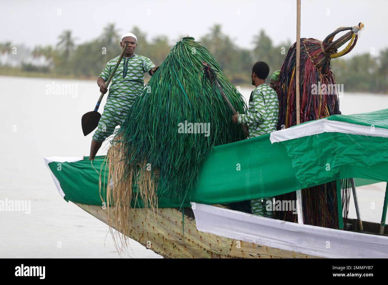 People prepare to parade for Zangbeto masquerade during Badagry ...