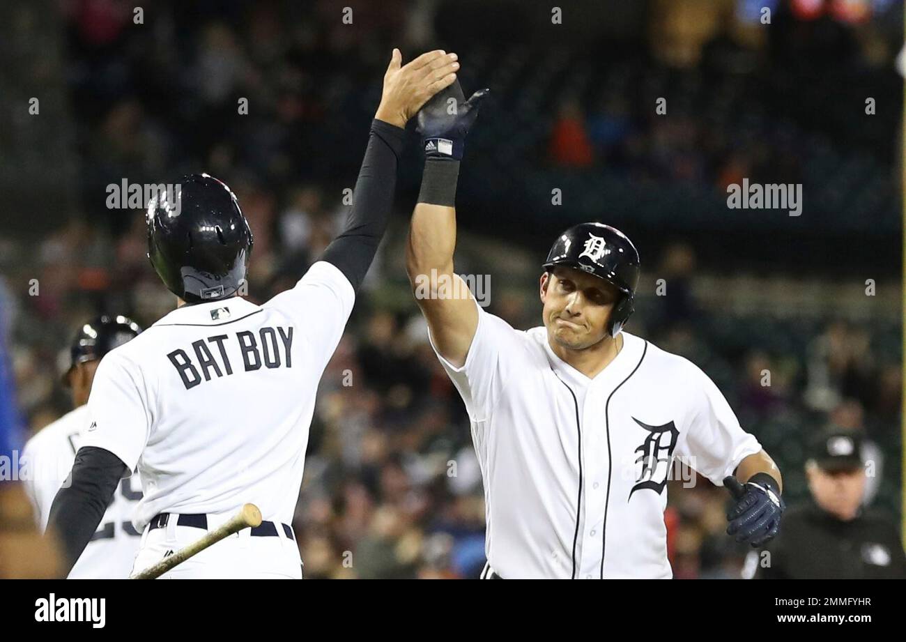 Detroit Tigers' Mikie Mahtook is greeted by the bat boy after a two-run ...