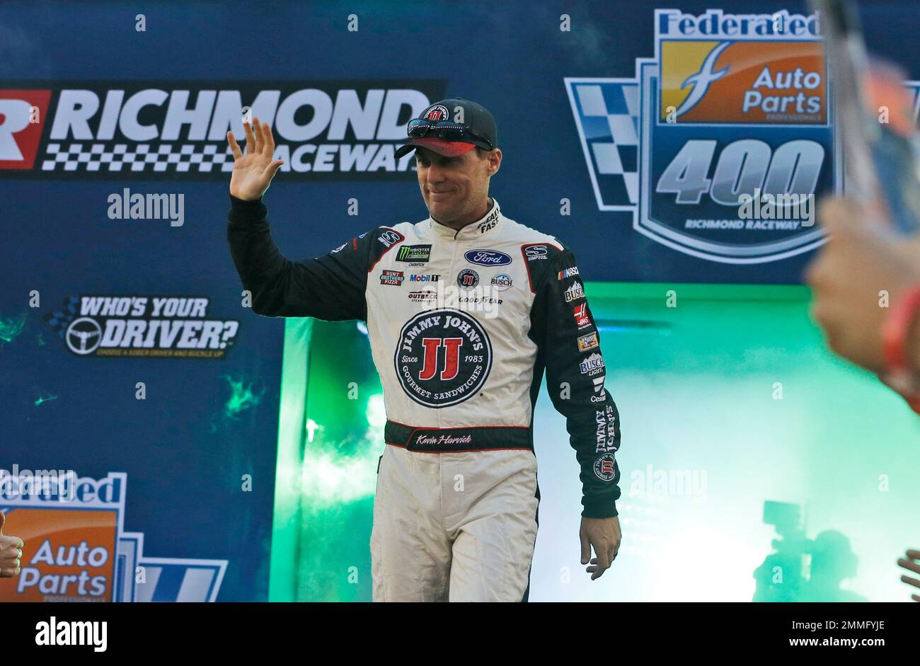 Kevin Harvick waves to the crowd during driver introductions prior to ...