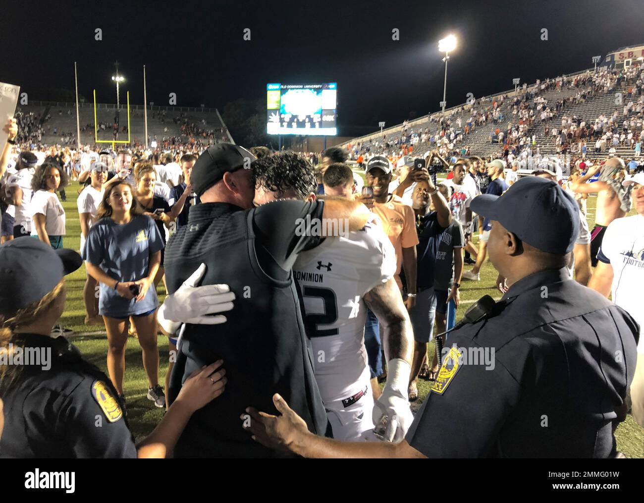 Old Dominion head football coach Bobby Wilder embraces his son Derek ...