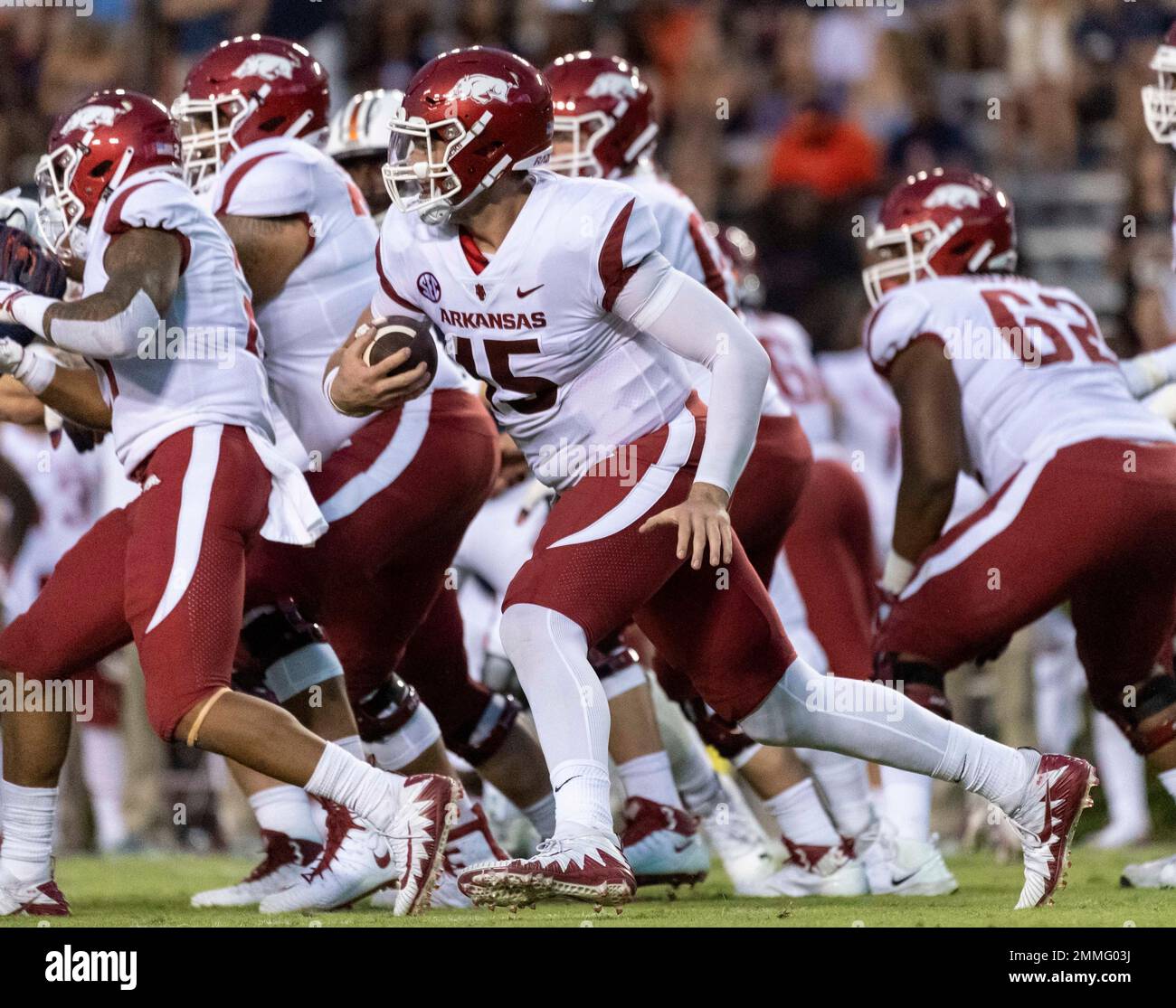 Arkansas quarterback Cole Kelley (15) runs to the edge against Auburn ...