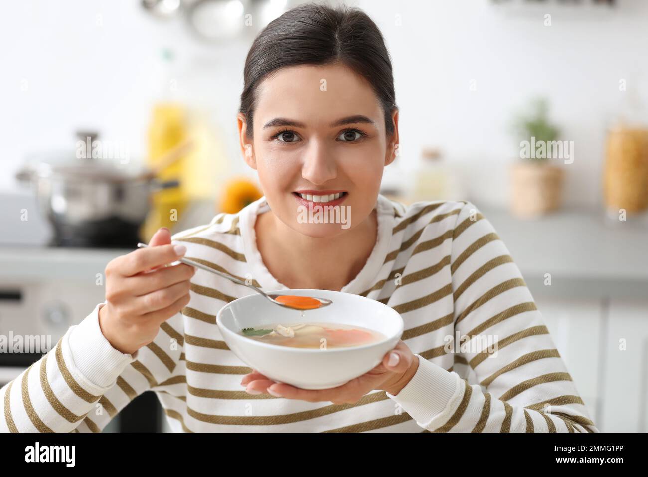 Happy woman eating supper hi-res stock photography and images - Alamy