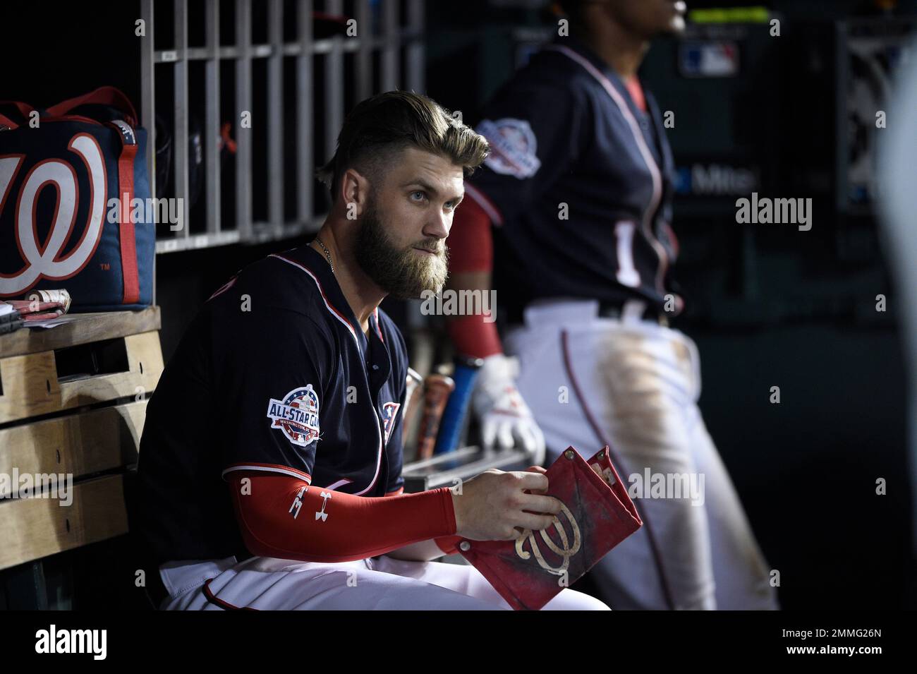 Washington Nationals' Bryce Harper watches from the dugout during the ...