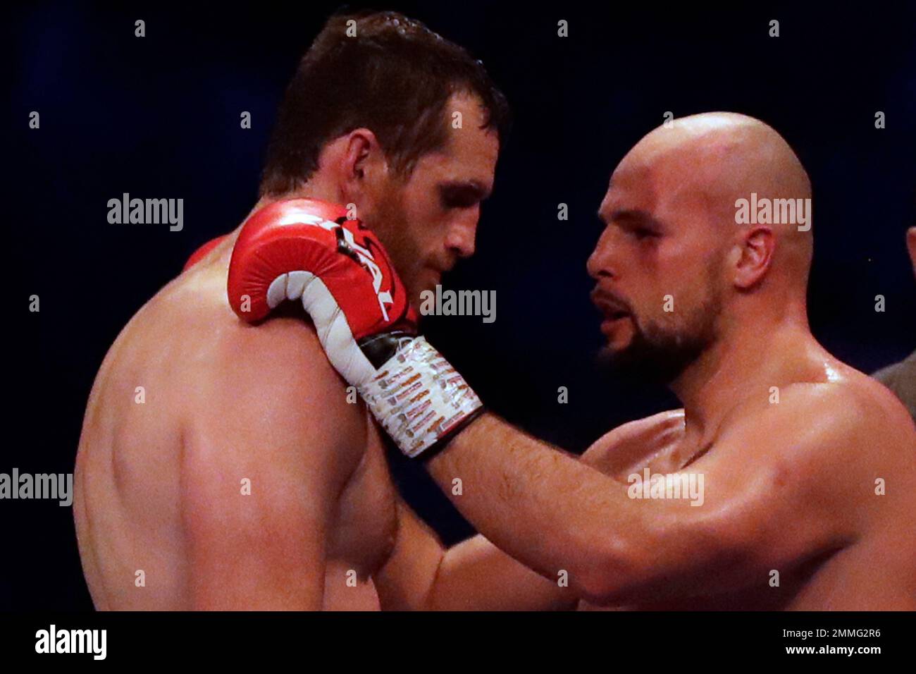 Russian boxer Sergey Kuzmin, right, hugs British boxer David Price who ...
