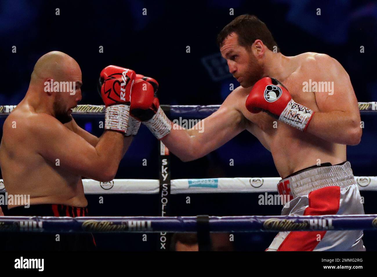 British boxer David Price throws a punch at Russian boxer Sergey Kuzmin, left, at Wembley ...