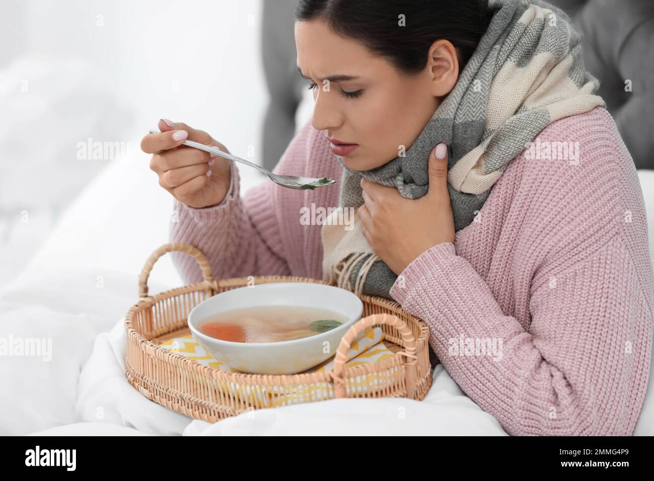 Woman eating in bed soup hi-res stock photography and images - Alamy