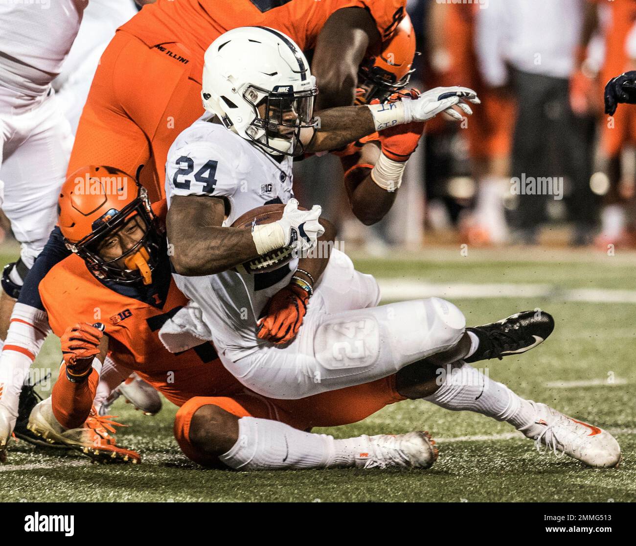 Penn State running back Miles Sanders (24) is tackled by Illinois' Del ...