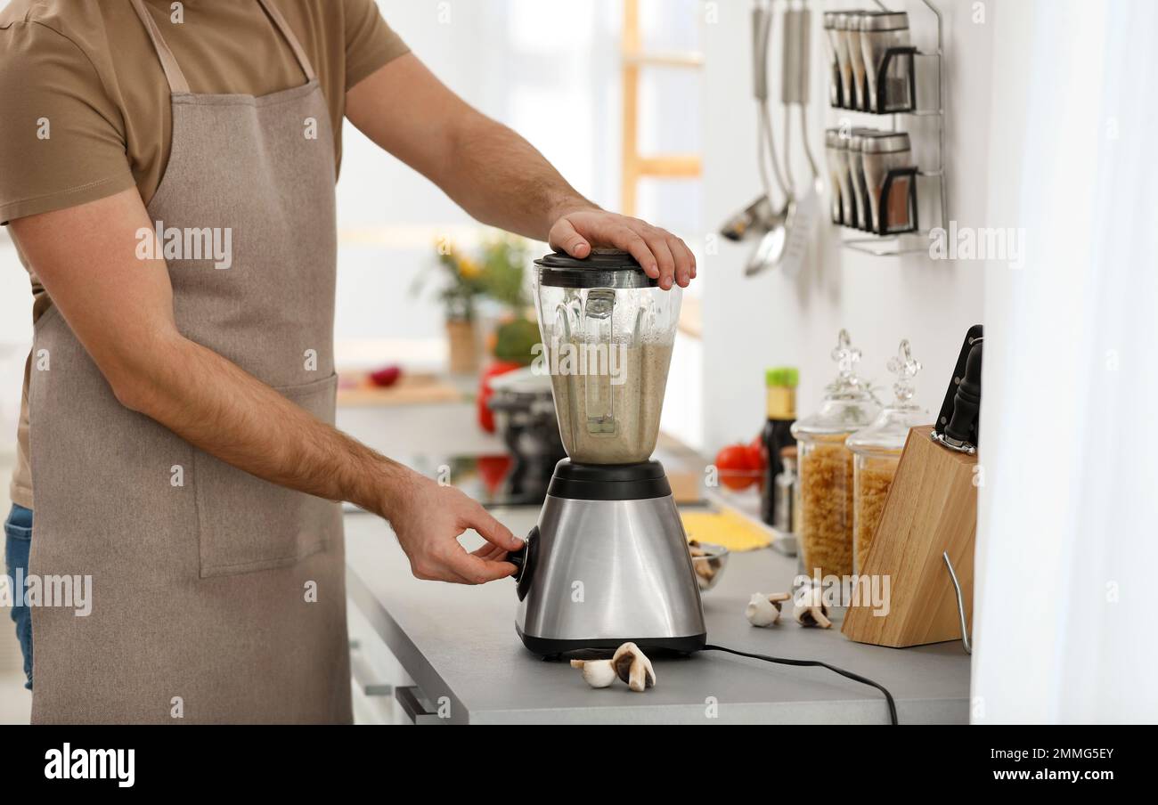 Man using blender in kitchen hi-res stock photography and images - Alamy