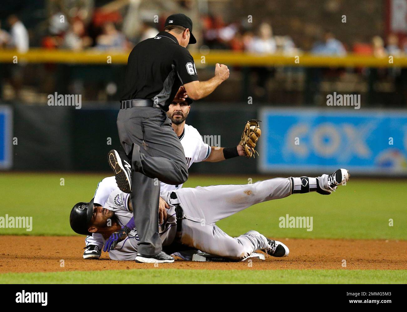 Arizona Diamondbacks second baseman Daniel Descalso tags out Colorado ...