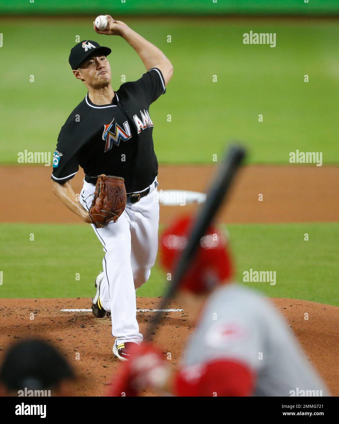 Miami Marlins' Wei-Yin Chen pitches to Cincinnati Reds' Joey Votto ...