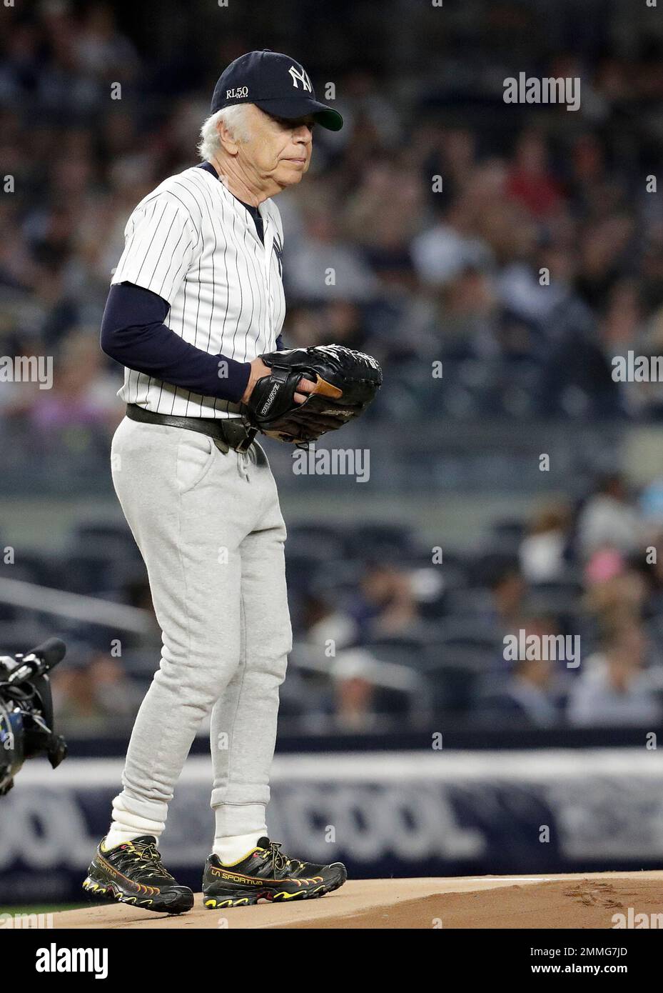 Designer Ralph Lauren looks on from the mound before throwing out the ...