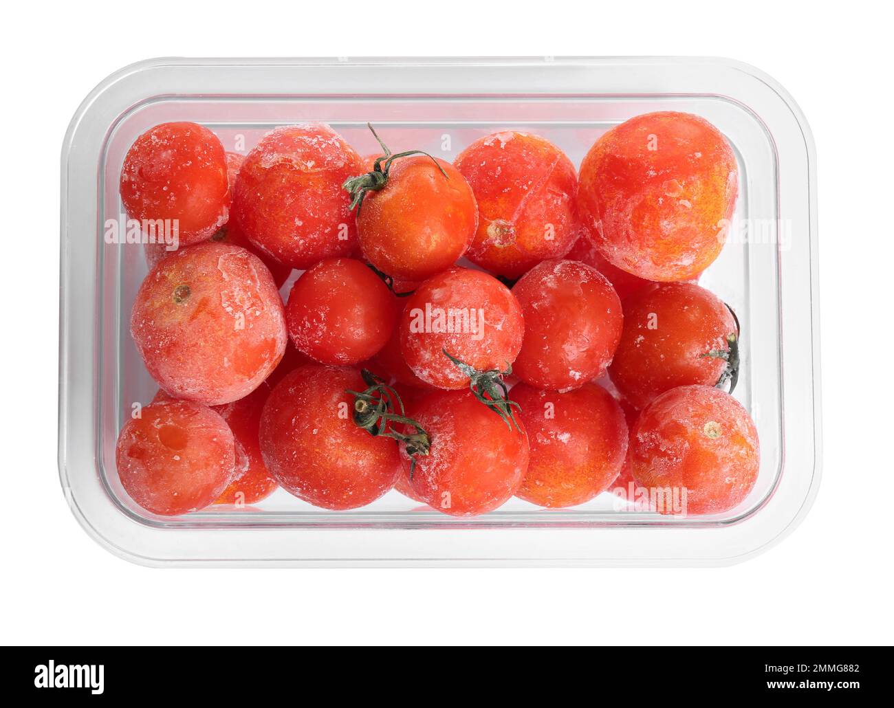 Frozen tomatoes in plastic container isolated on white, top view ...