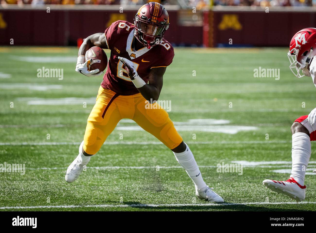 Minnesota wide receiver Tyler Johnson gets past Miami (Ohio) defenders ...