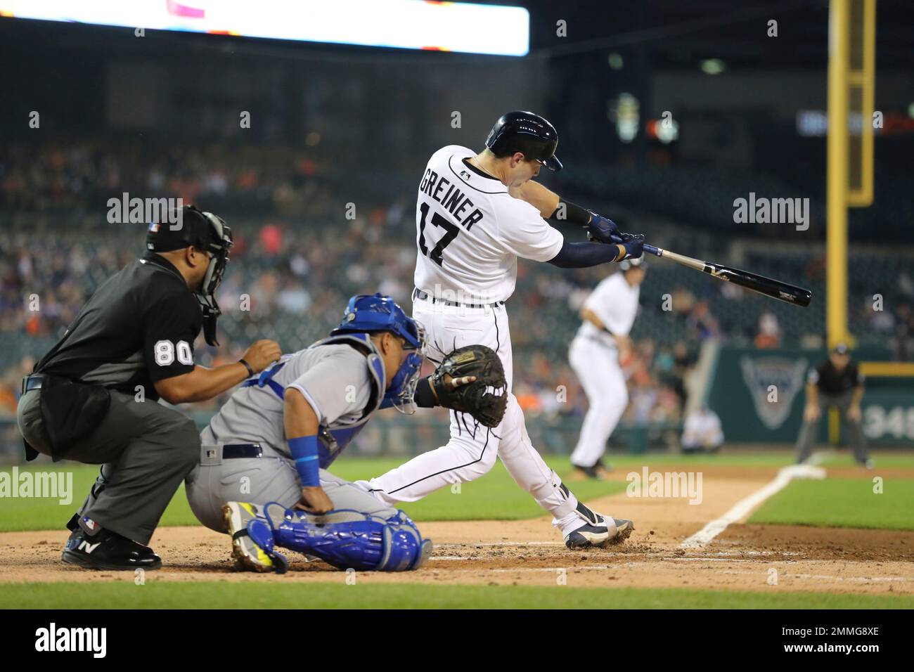 Detroit Tigers' Grayson Greiner bats as umpire Adrian Johnson (80) and ...