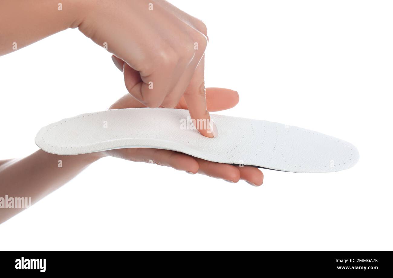 Woman showing orthopedic insole on white background, closeup Stock ...