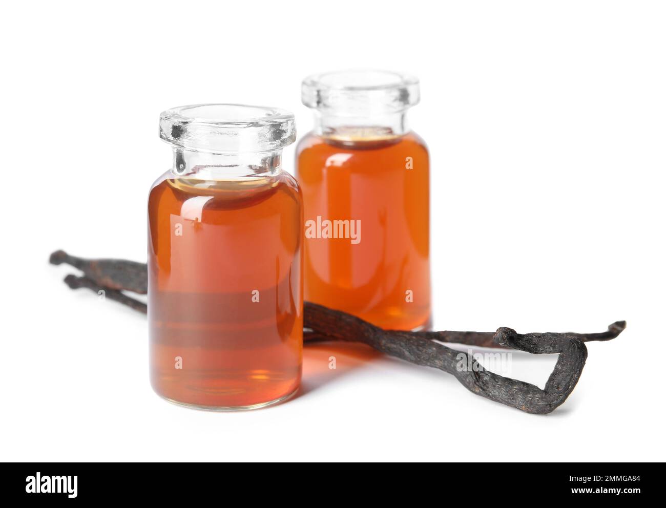 Vanilla extract and dry pods isolated on white Stock Photo - Alamy