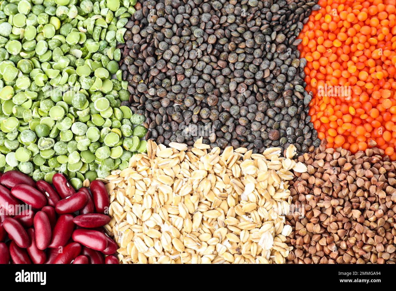 Different grains and cereals as background, top view Stock Photo - Alamy