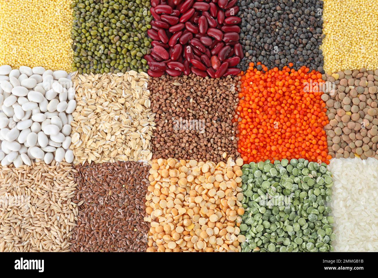 Different grains and cereals as background, top view Stock Photo - Alamy