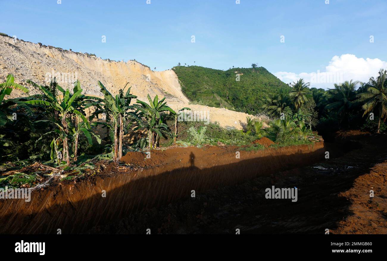The extent of a massive landslide is seen in Naga, central Philippines ...