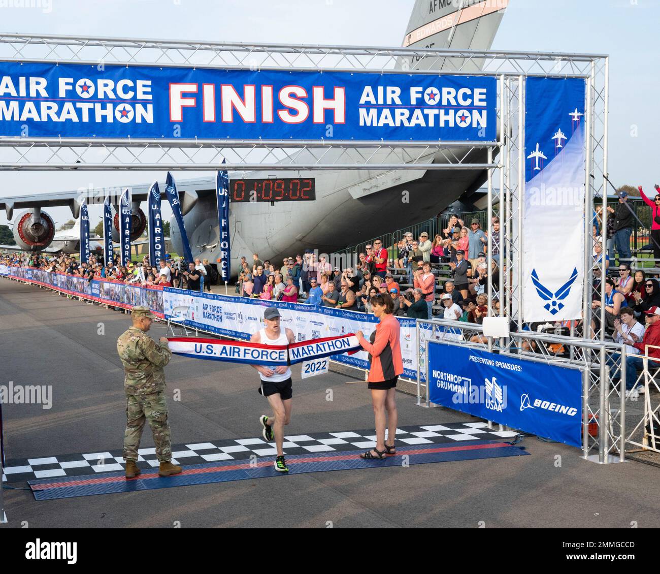 John Mascari crosses the finish line of the 10K race during the 2022 Air Force Marathon at ...