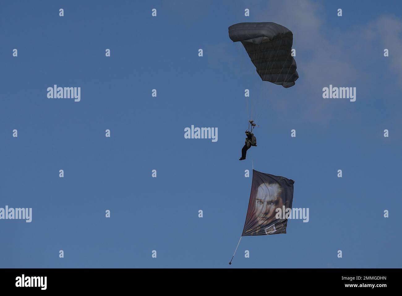 Turkish Forces officers parachute with a poster of modern Turkey's ...