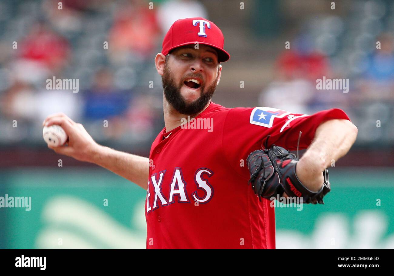 Texas Rangers pitcher Chris Martin delivers against the Tampa Bay Rays ...