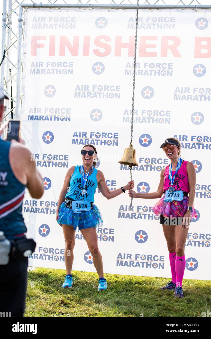 Missy Woessner (left) and Eleanor Anderson (right) ring the finishing ...