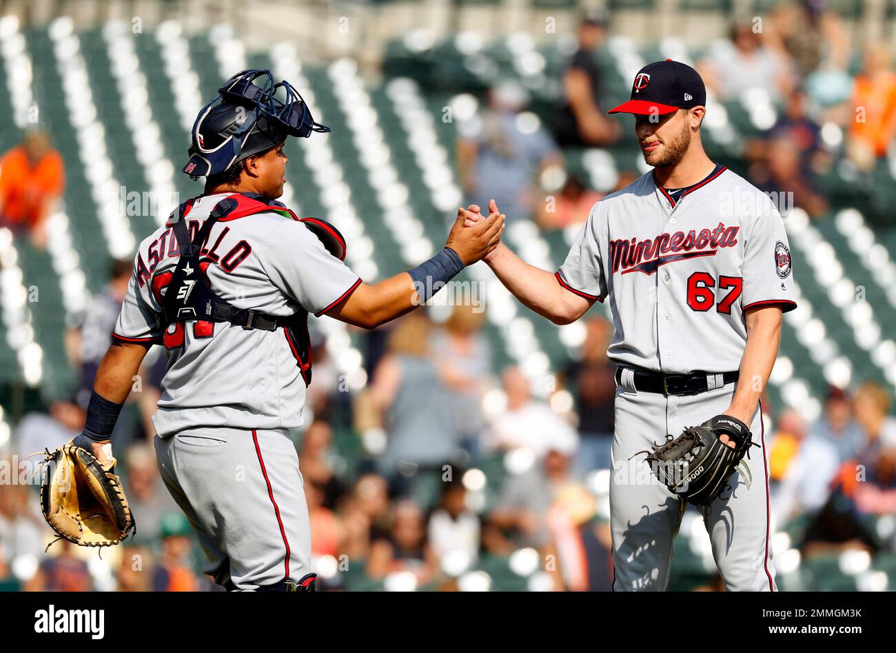 Minnesota Twins catcher Willians Astudillo (64) and relief pitcher Alan ...