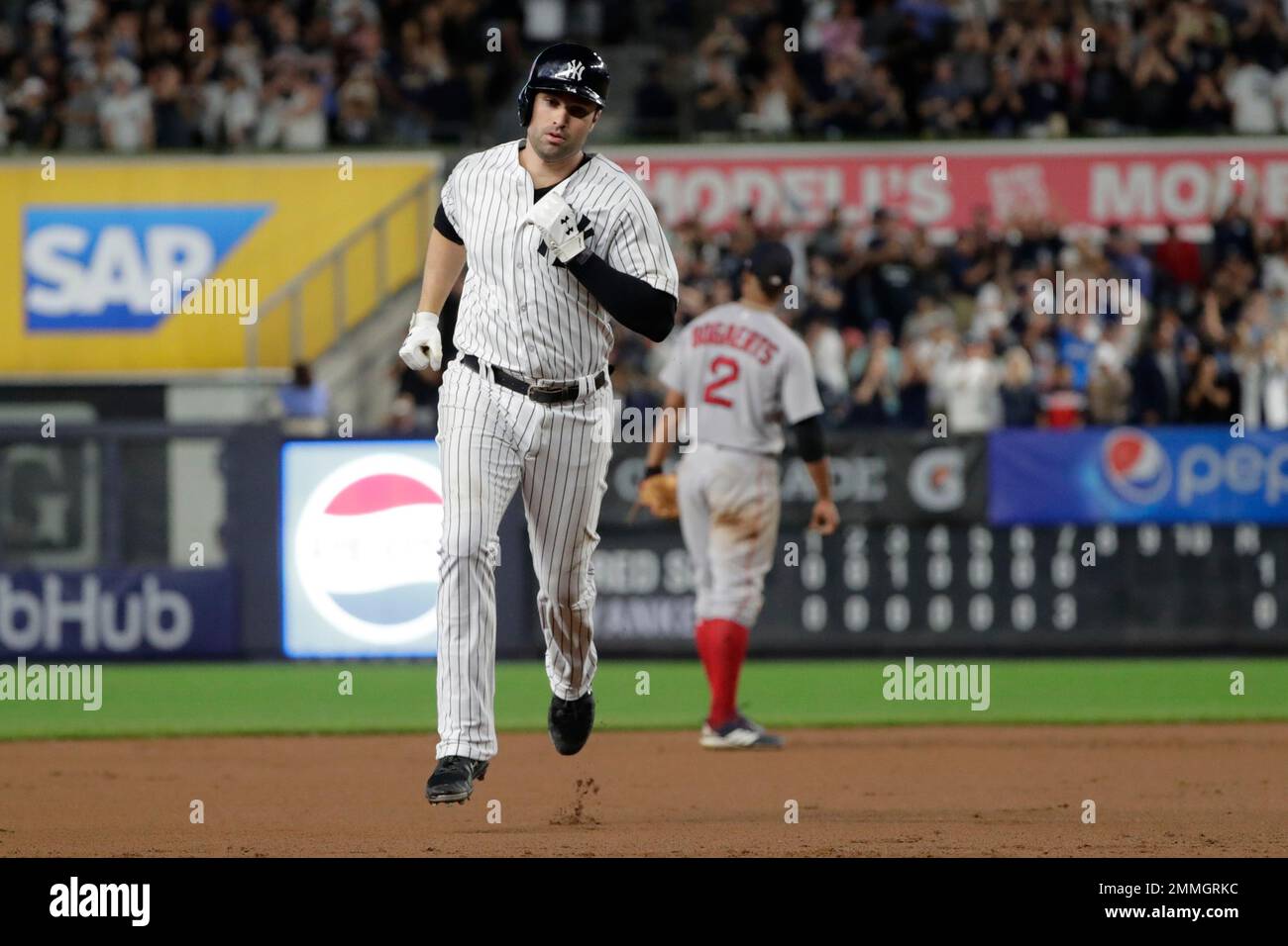 New York Yankees' Neil Walker runs the bases after hitting a three-run ...