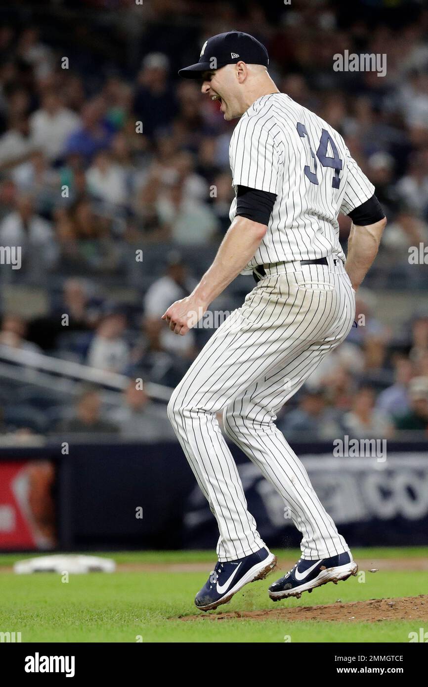 New York Yankees starting pitcher J.A. Happ reacts after striking out ...