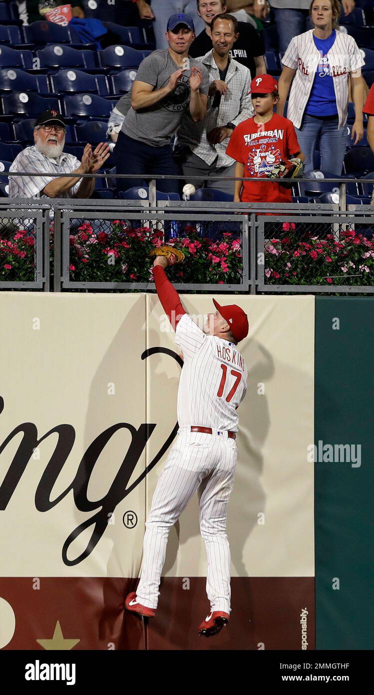 Philadelphia Phillies left fielder Rhys Hoskins cannot reach a home run ...
