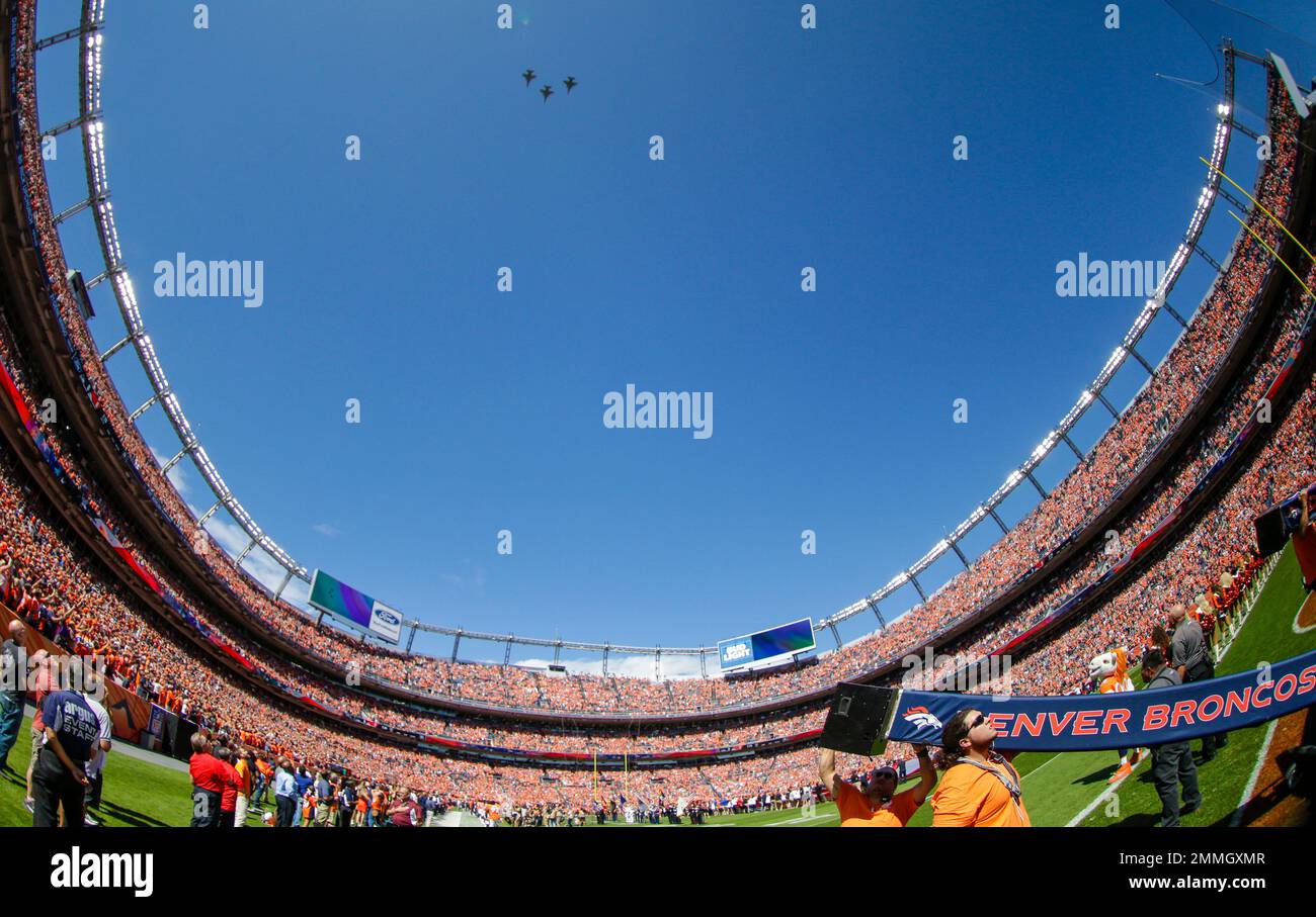 A military fly over during the first half of an NFL football game ...