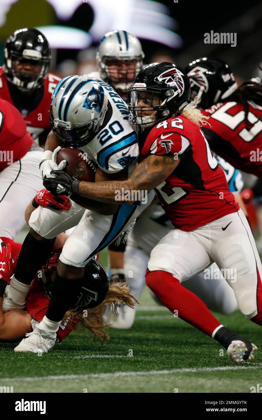 Carolina Panthers running back C.J. Anderson (20) is tackled by Atlanta ...