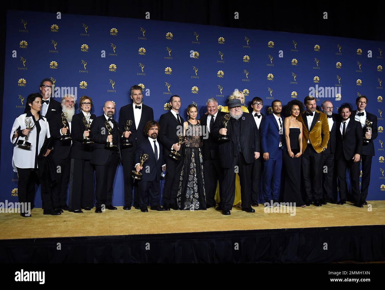 George R. R. Martin, center, and the cast and crew of "Game of Thrones ...
