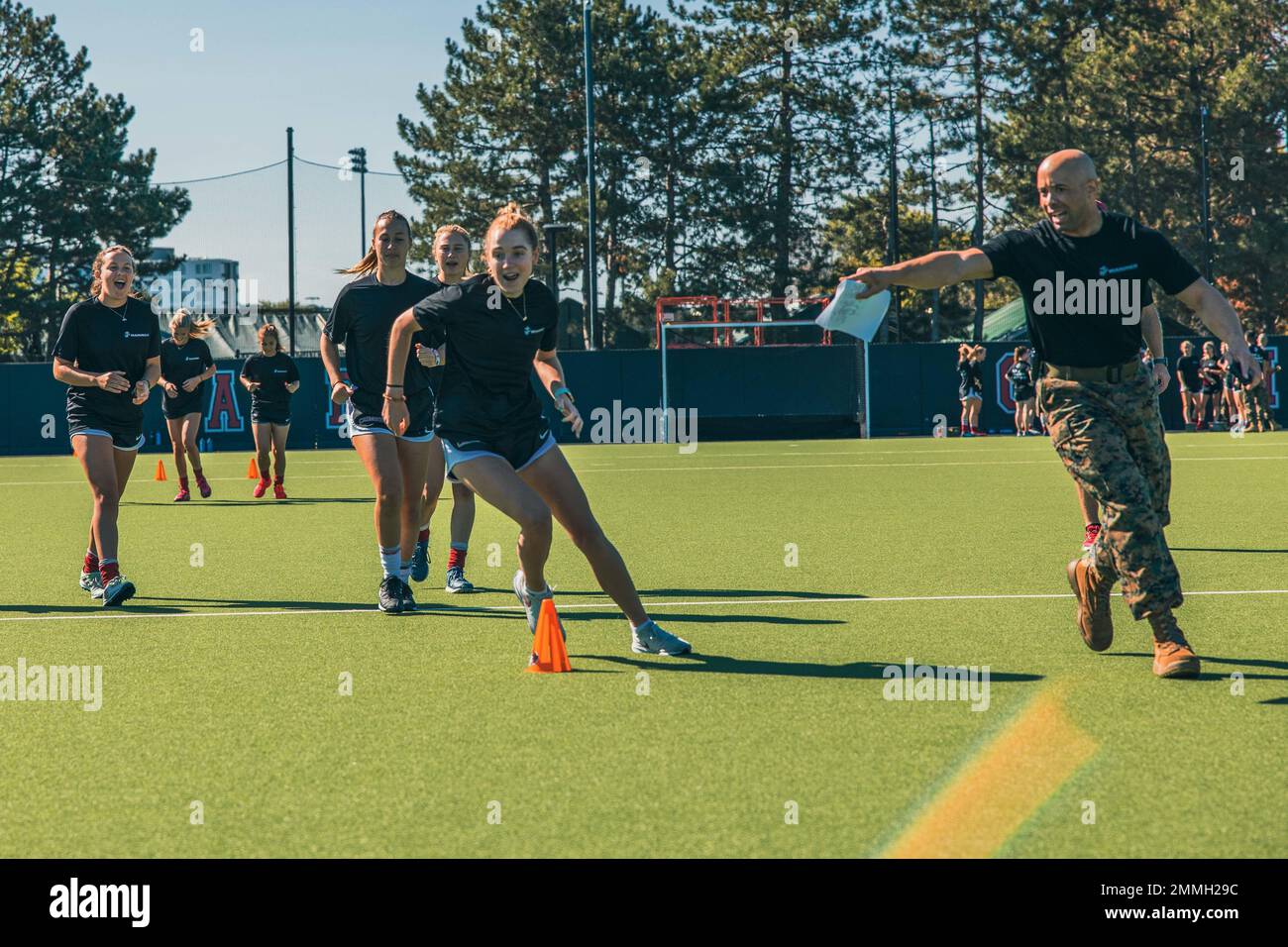 A member of Harvard University’s field hockey team zig-zags through ...
