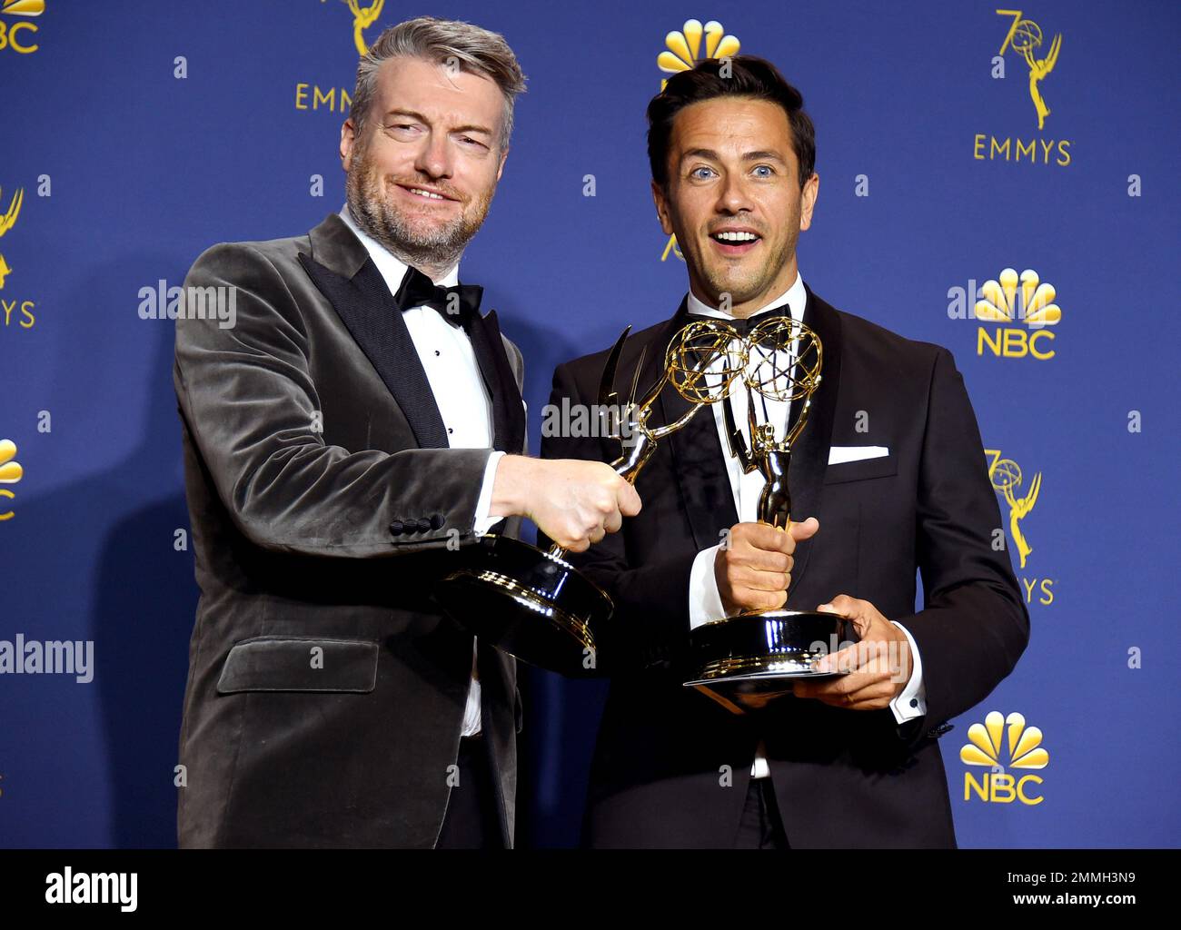 Charlie Brooker, left, and William Bridges pose in the press room with ...
