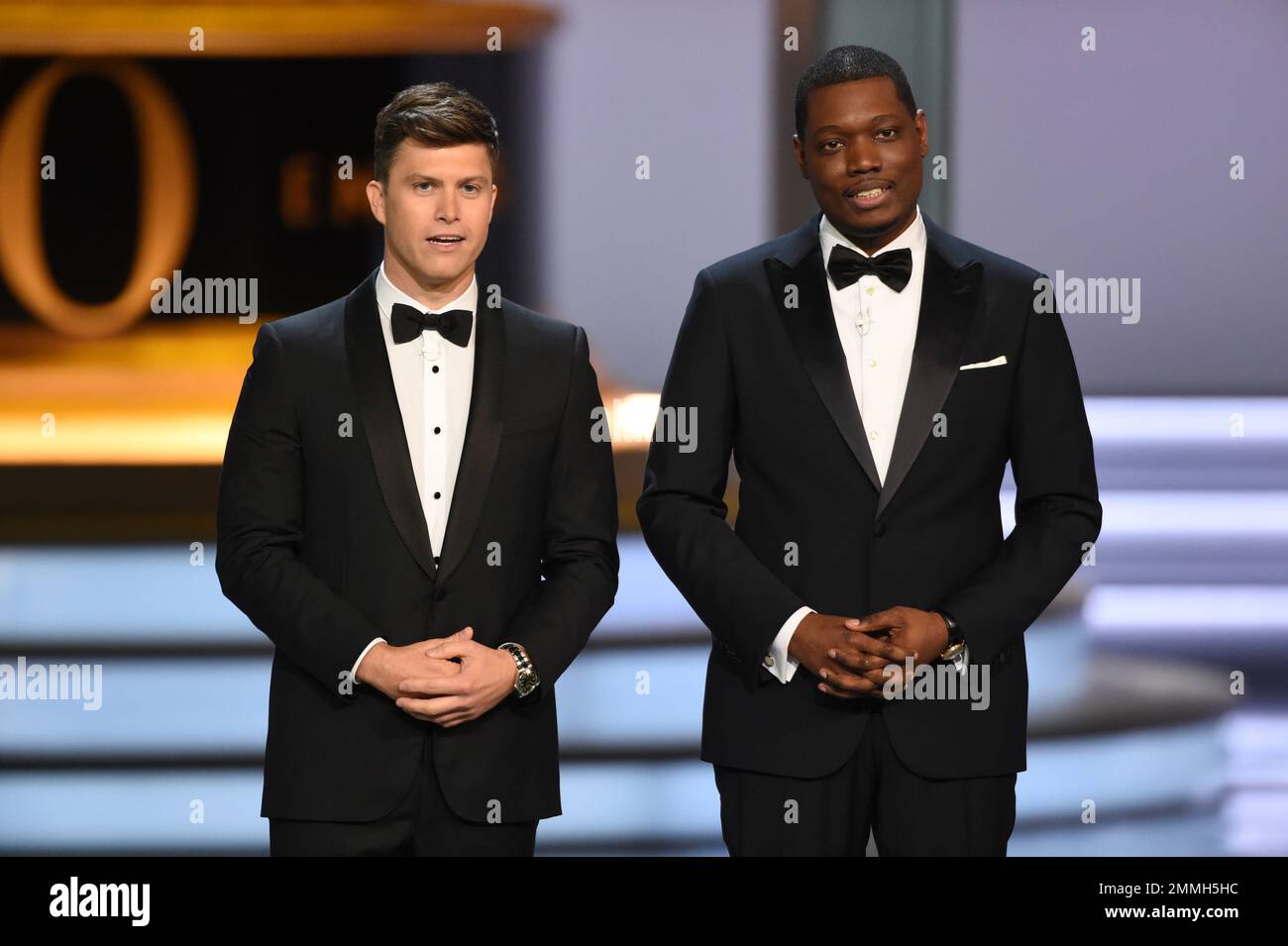 Hosts Colin Jost, left, and Michael Che speak at the 70th Primetime ...